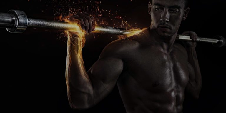 Creative Sport. Closeup portrait of professional bodybuilder with fire ...